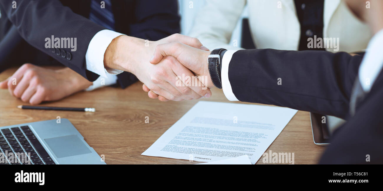 Business people shaking hands at meeting or negotiation in the office ...