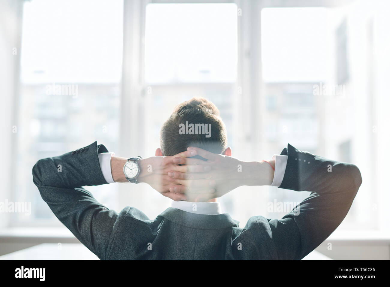 Sitting in front of window Stock Photo - Alamy