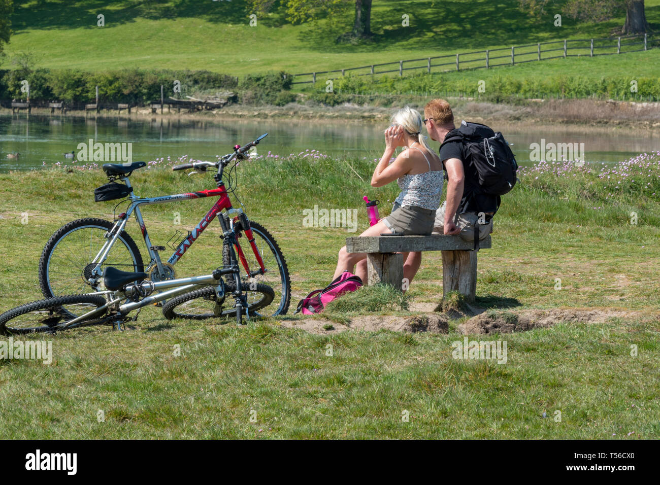 Cyclists resting on bench hi-res stock photography and images - Alamy