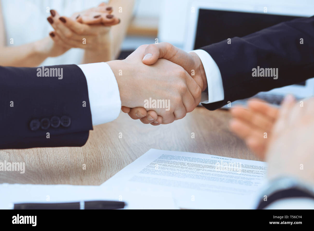 Business people shaking hands at meeting or negotiation in the office ...