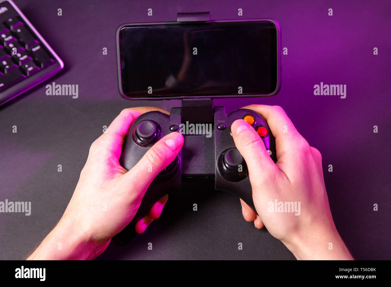 Man hands playing a computer game with a game joystick Stock Photo - Alamy