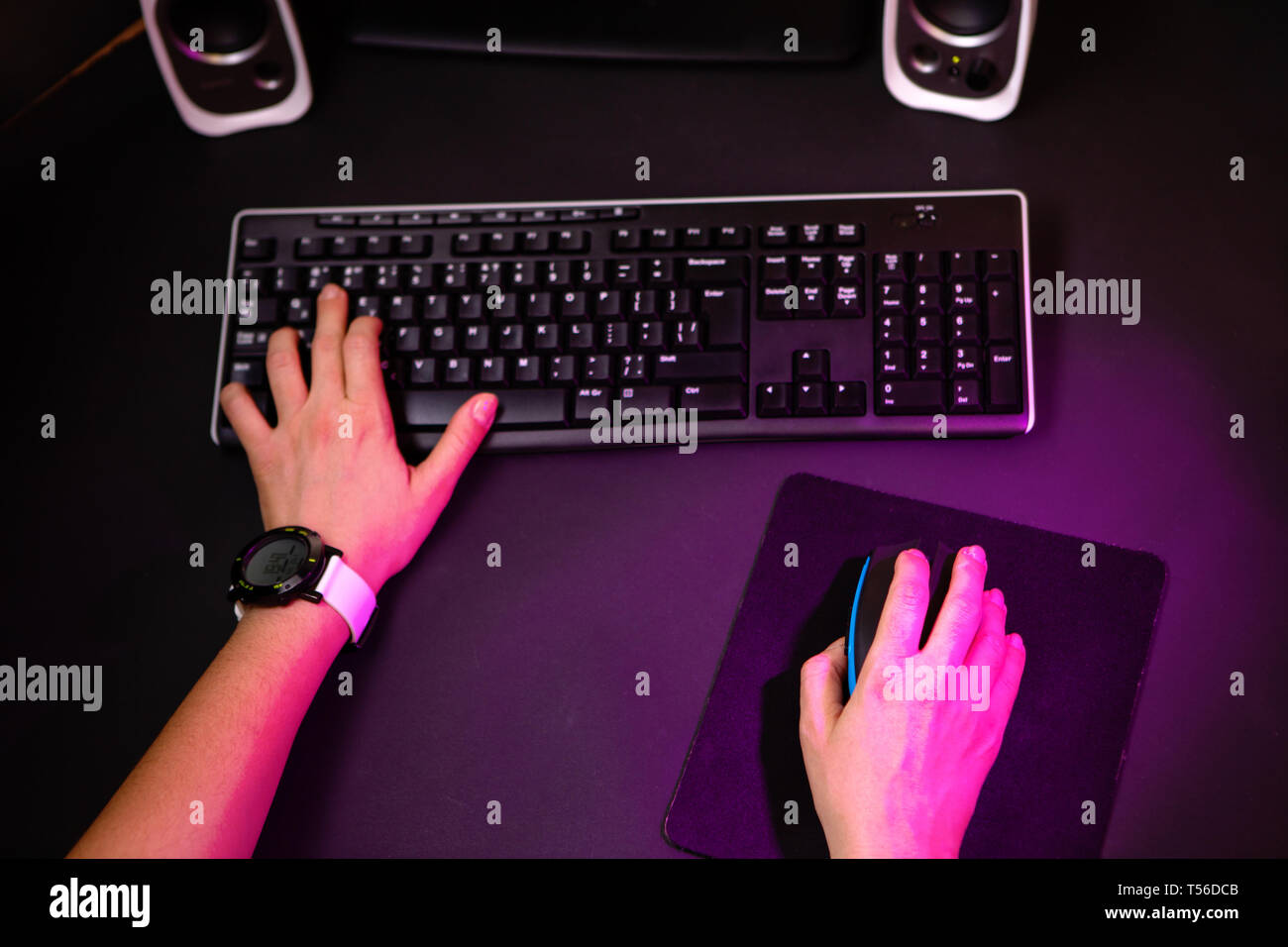 Female hands playing computer game with mouse and keyboard Stock Photo ...