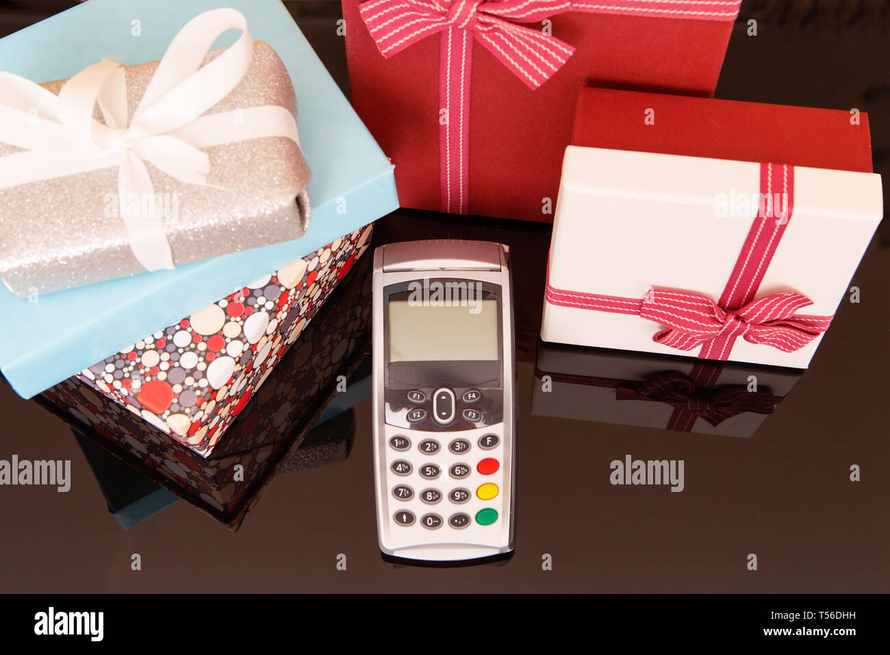Terminal, boxes with gifts on black glass table Stock Photo - Alamy