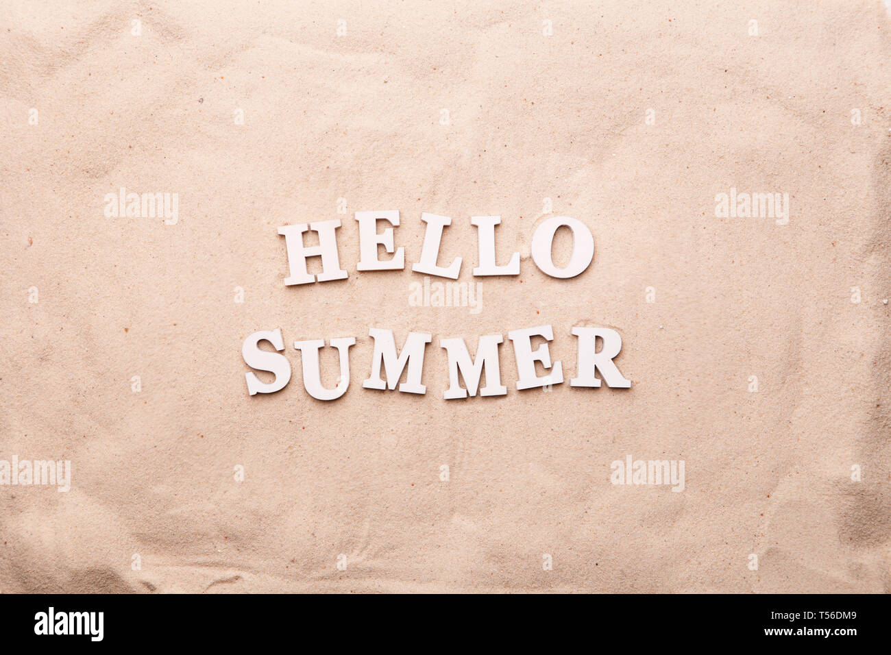 Text Hello Summer from white letters on sand Stock Photo - Alamy
