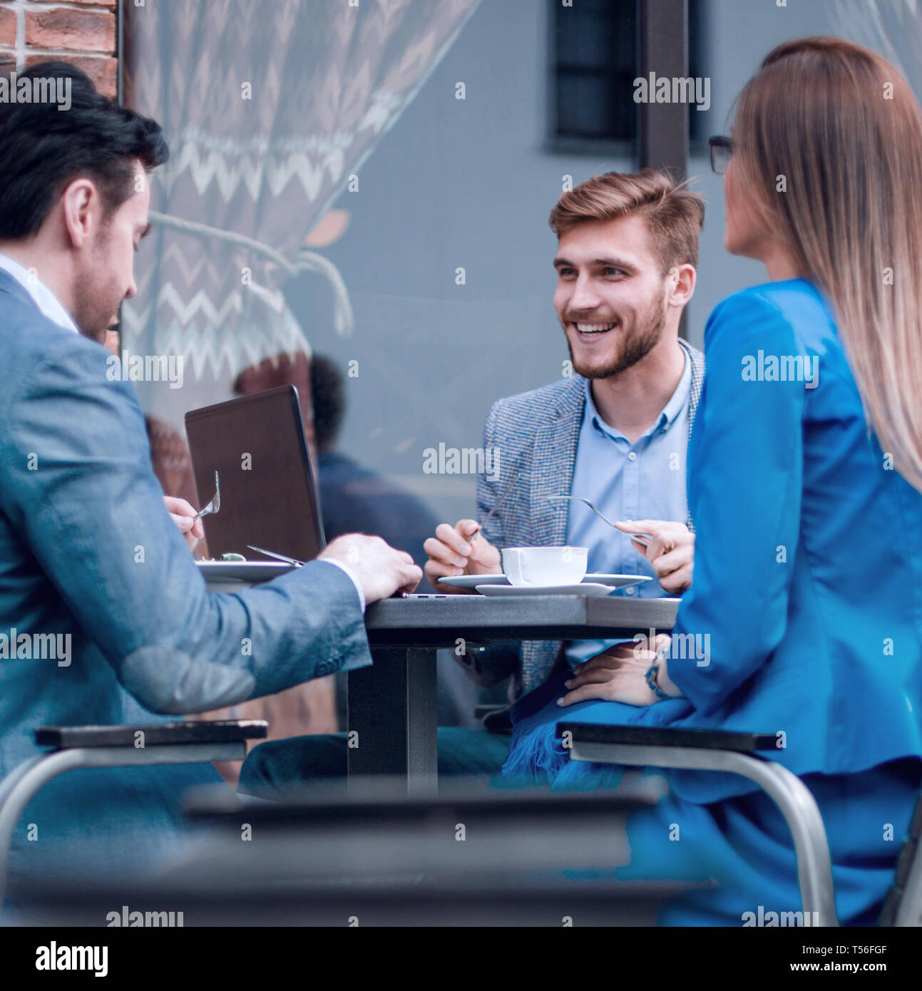business colleagues discussing business issues at the coffee table .the ...