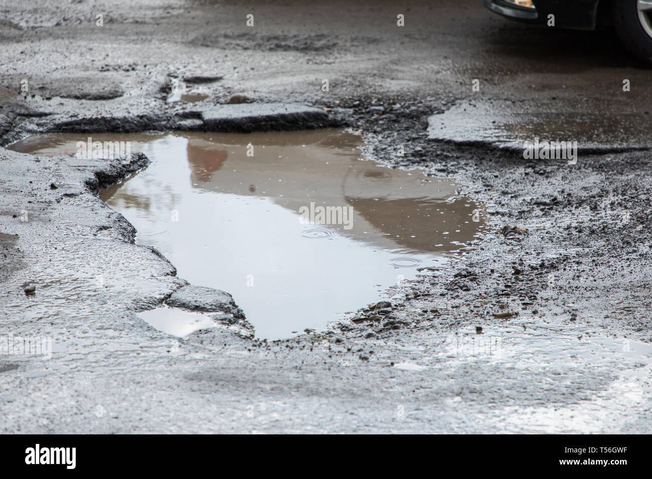 Pothole in pavement signifying failing infrastructure Stock Photo - Alamy