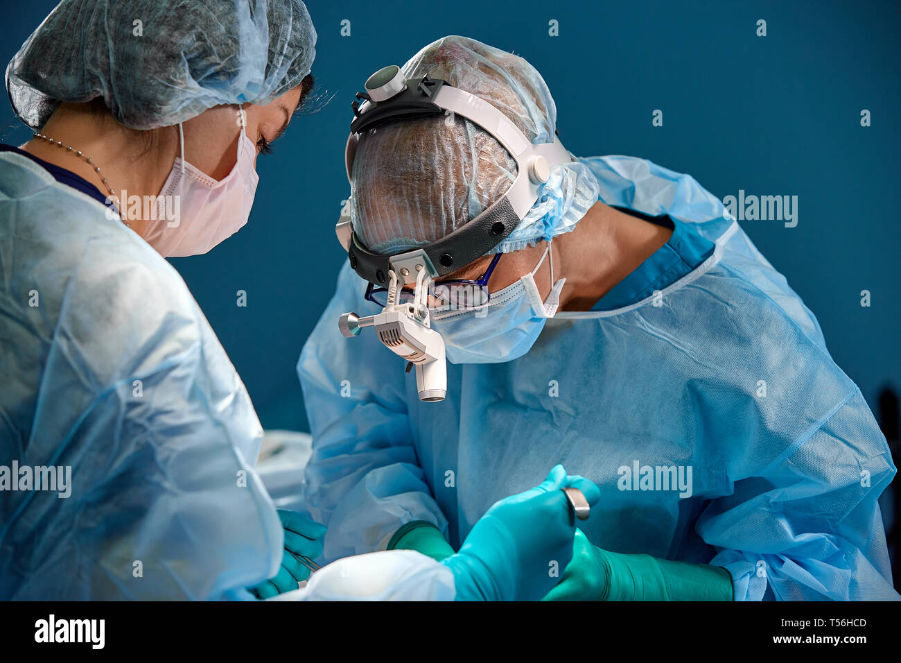 Doctor and assistant nurse operating for rescue patient from dangerous ...