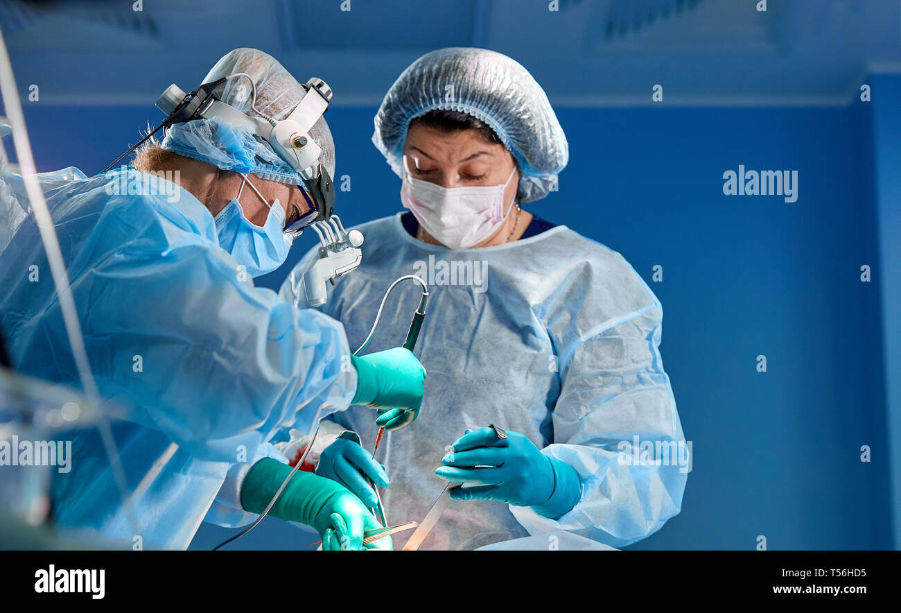 Doctor and assistant nurse operating for rescue patient from dangerous ...