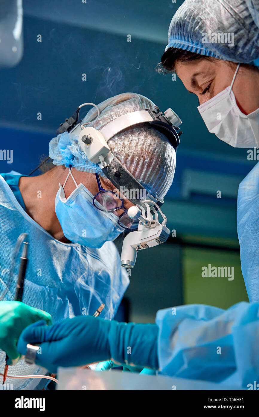 Doctor and assistant nurse operating for rescue patient from dangerous ...