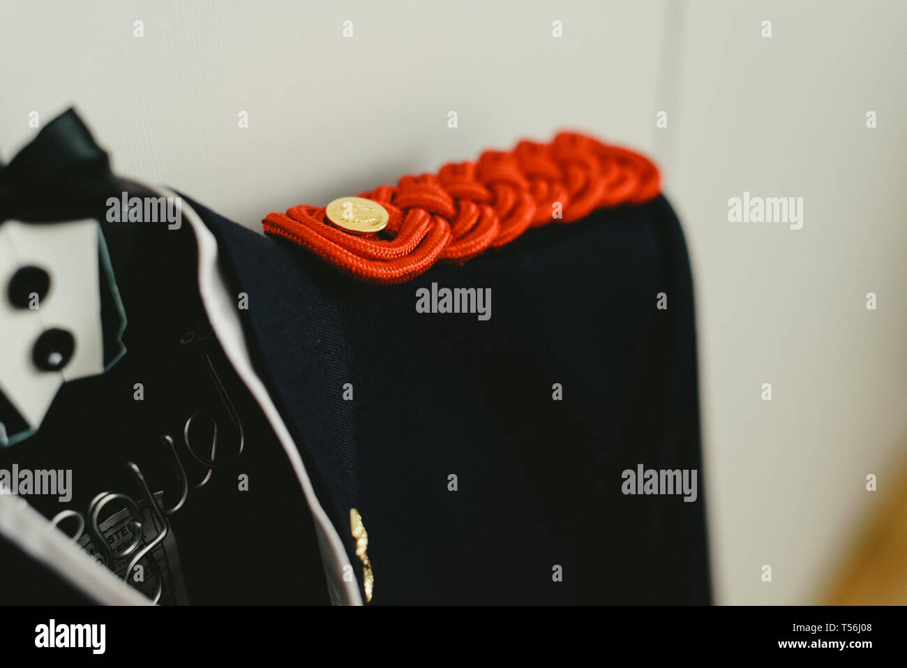 Military dress suit jacket hanging on a hanger Stock Photo - Alamy