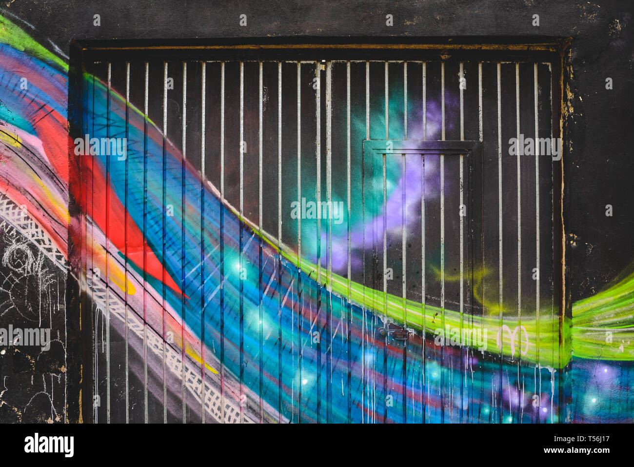 Detail of an anonymous street graffiti with many colors, cheerful urban ...
