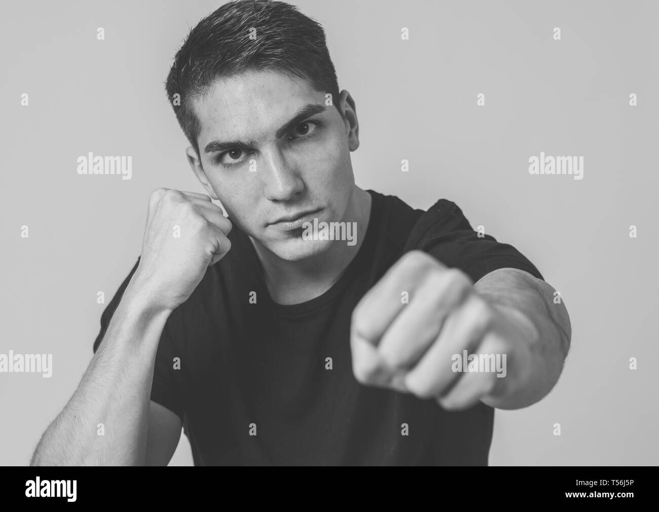 Defiant stance Black and White Stock Photos & Images - Alamy