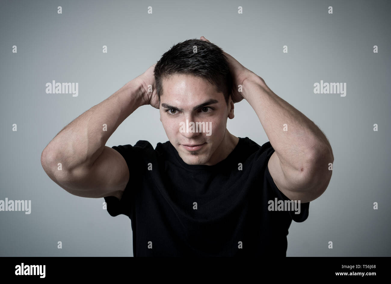 Portrait of frustrated mixed race young man with angry and stressed ...