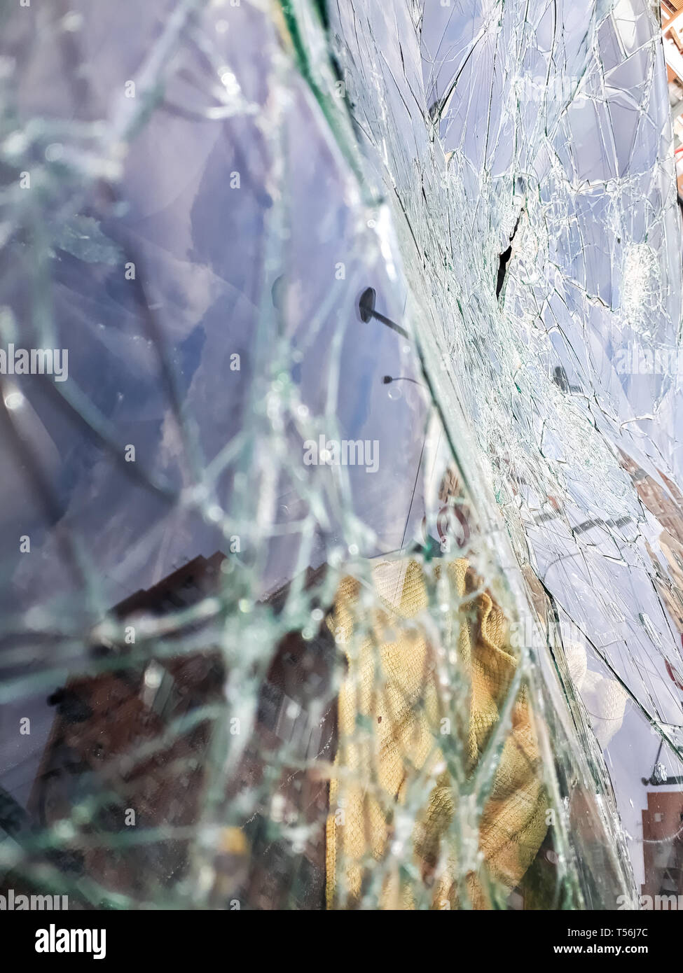 Broken windshield of abandoned and destroyed car, with broken glass ...
