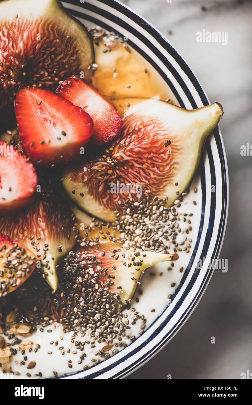 Healthy detox breakfast bowl with yogurt, fruits and honey, close-up ...