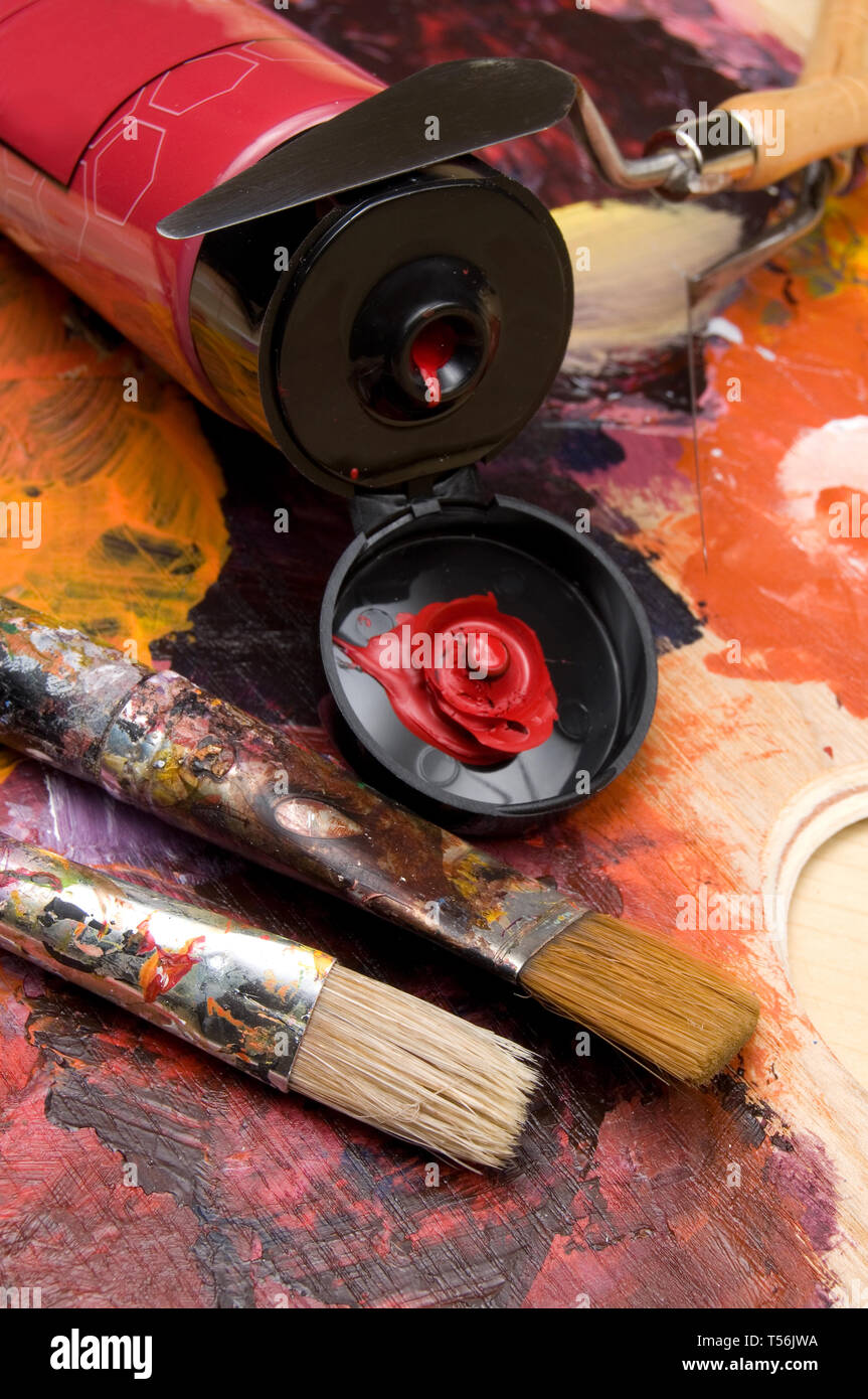 Painters Brushes, Red Paint Tube and Palette Stock Photo - Alamy