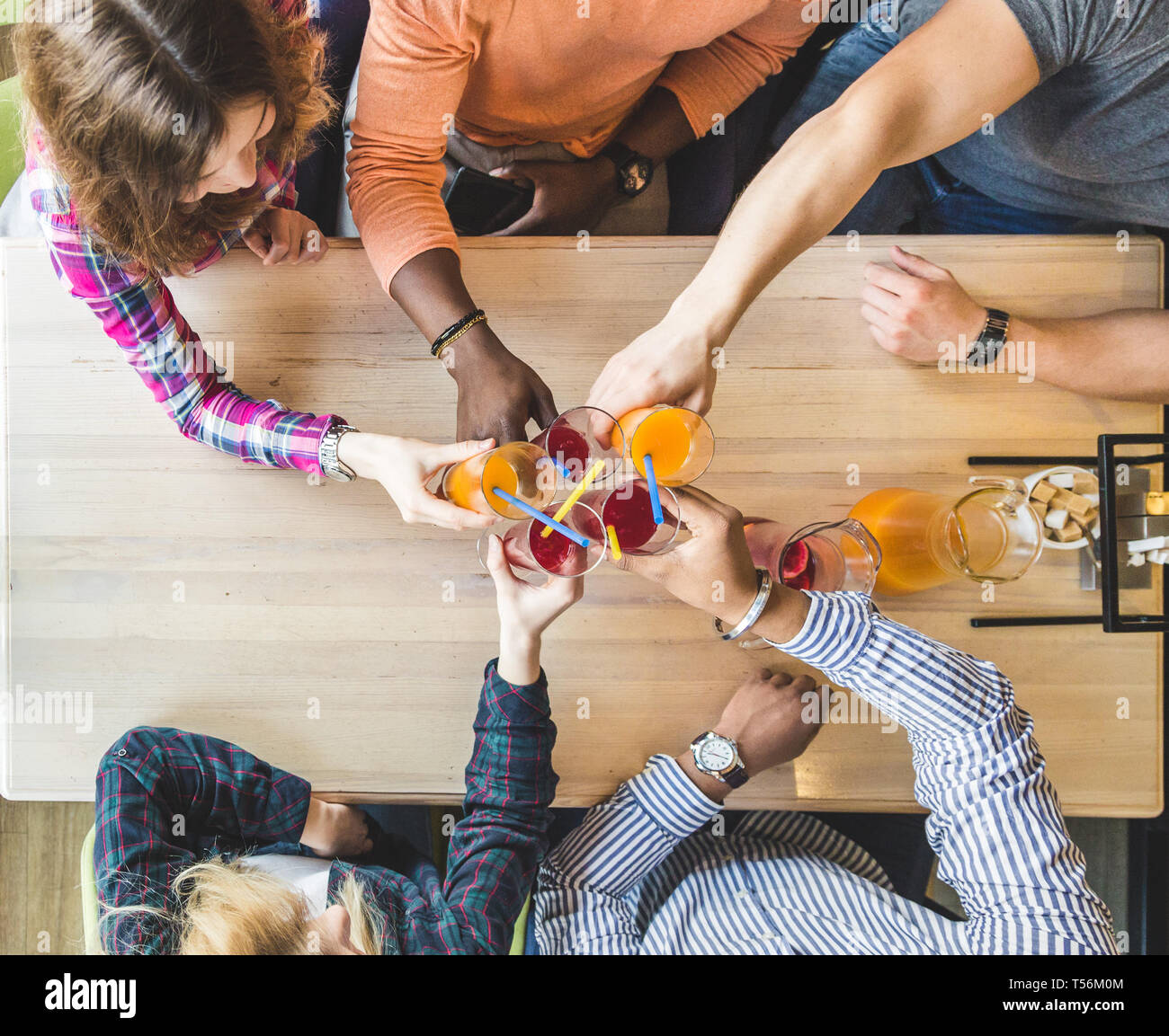 A company of young people having fun, drinking drinks, cocktails ...