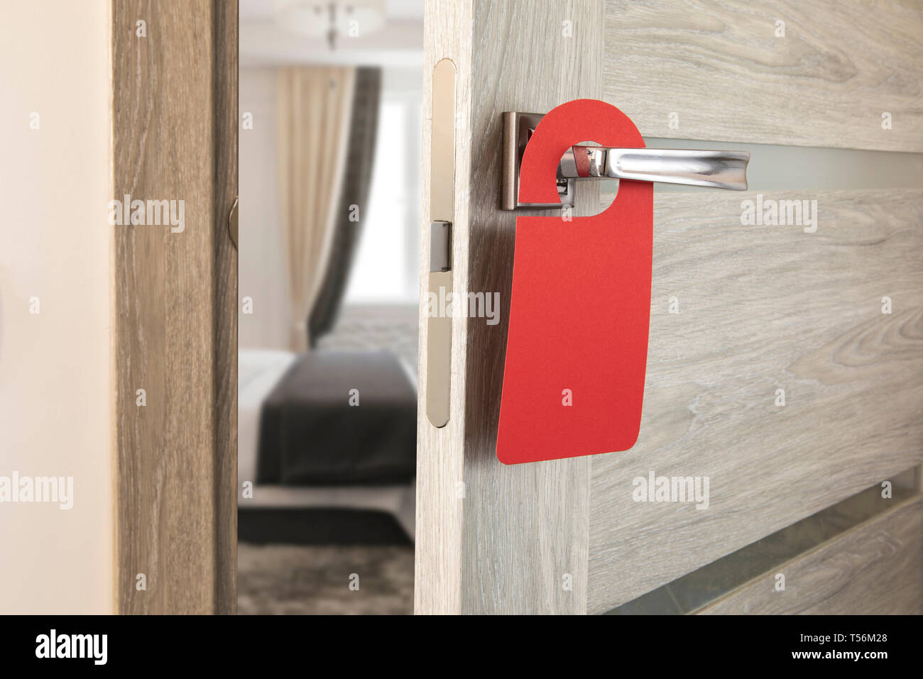 A door handle with blank paper hanger Stock Photo - Alamy
