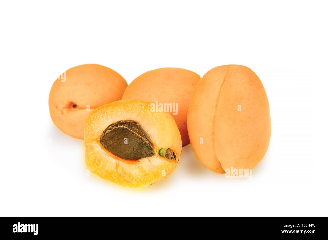 Group of ripe apricotes isolated with clipping path. Whole and half ...