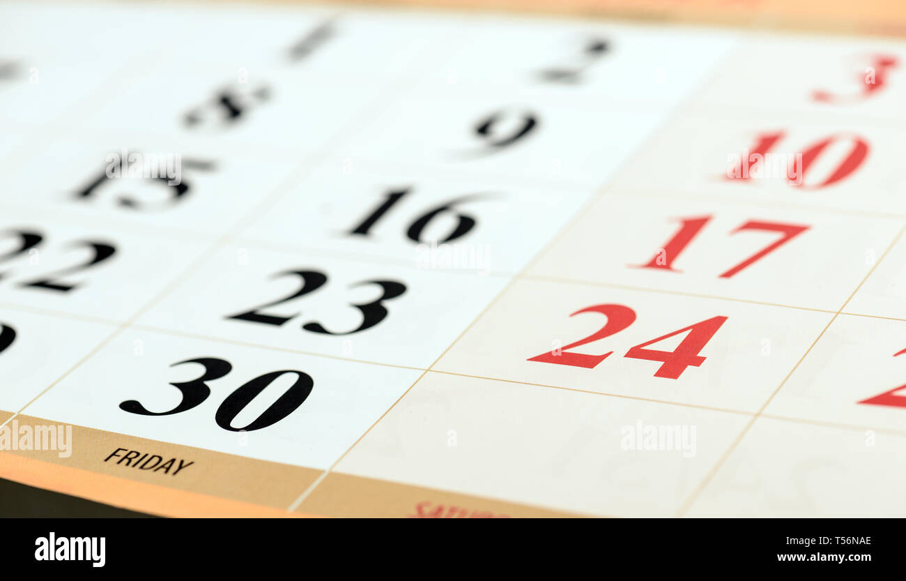 Calendar fragment perspective shot with partial blurred areas. Number ...