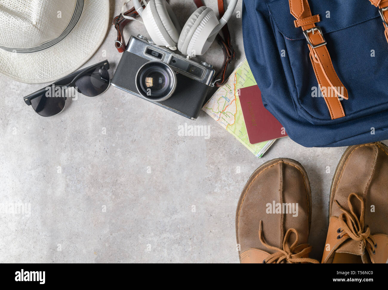 prepare backpack accessories and travel items on marble background ...