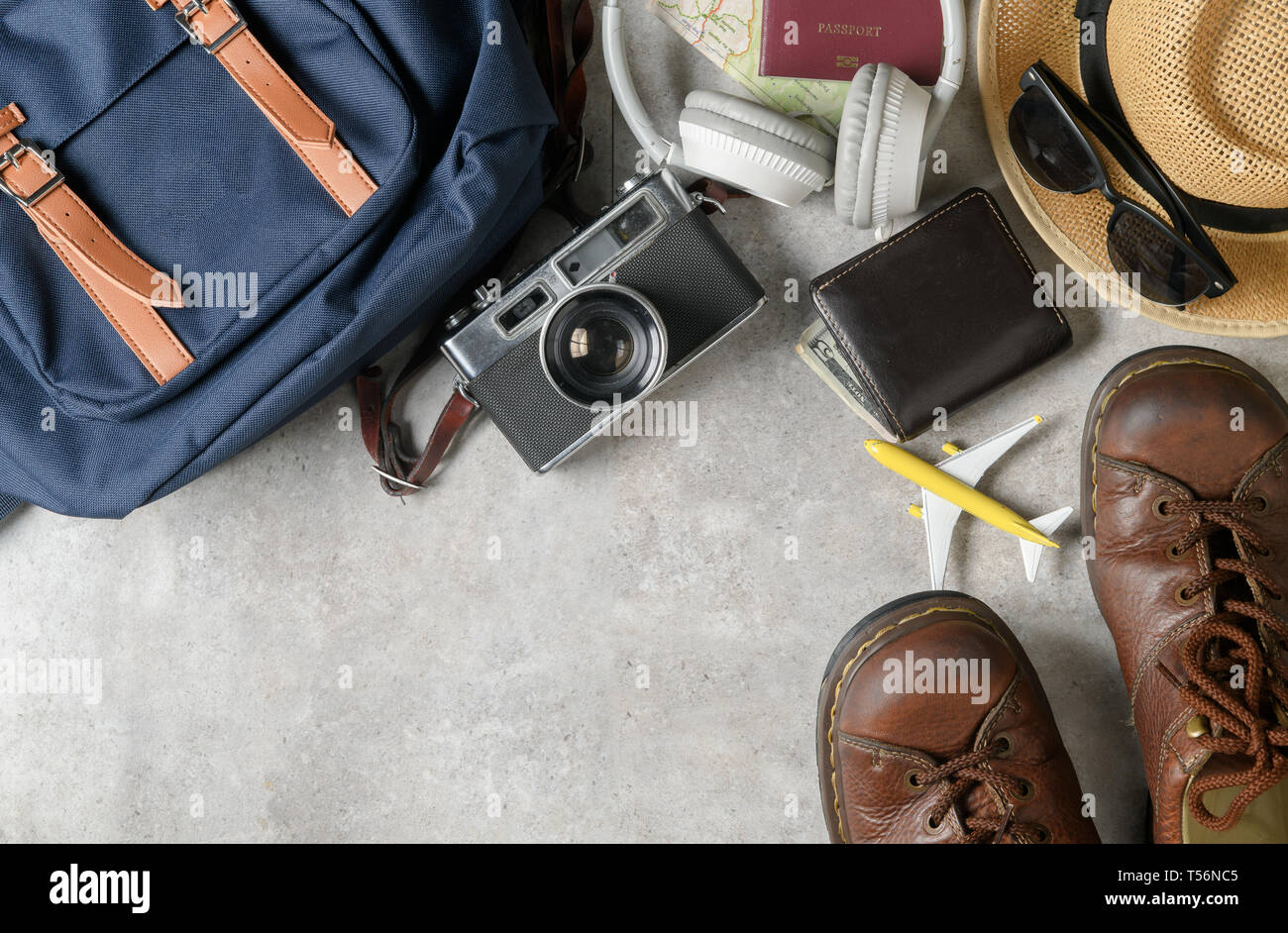 prepare backpack accessories and travel items on marble background ...