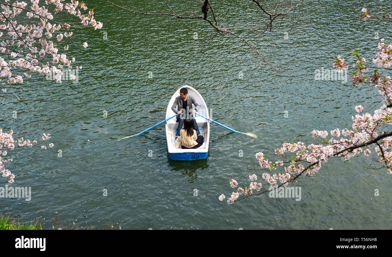 Tokyo, Japan - Apr 7, 2019. People enjoy cherry blossoms from rowing ...