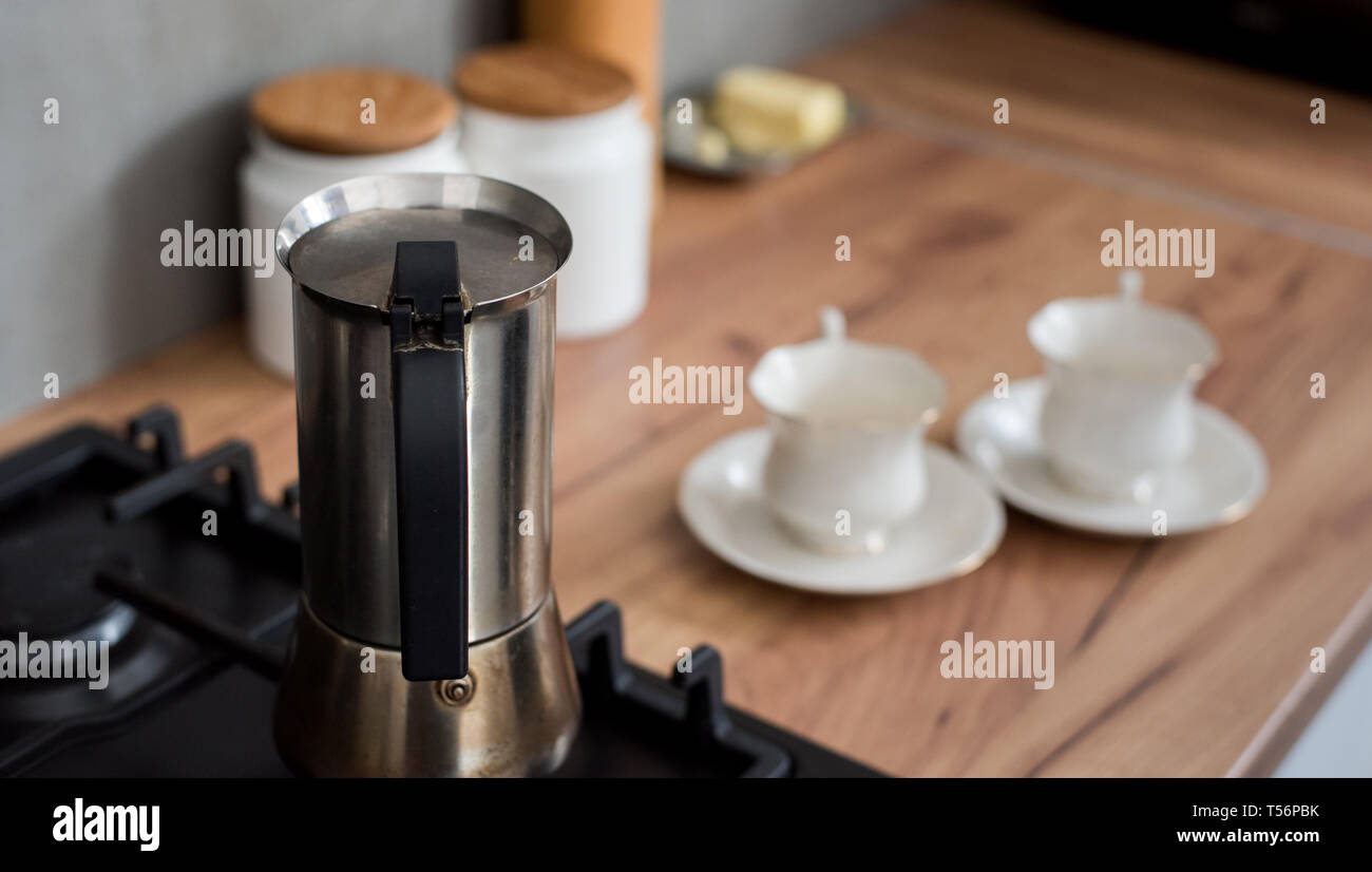 Preparing a traditional italian style coffee with coffee percolator ...