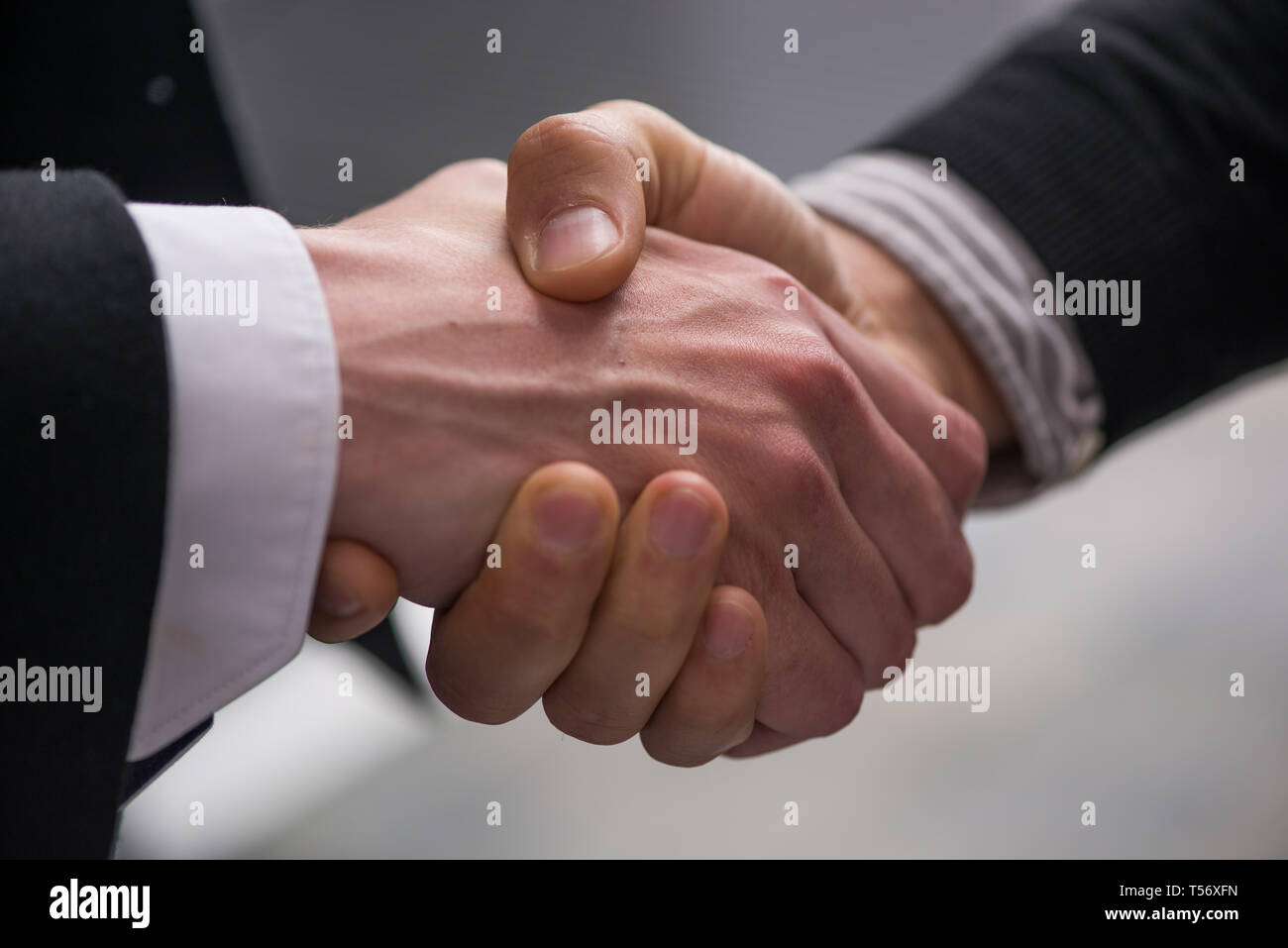 Business people in formal wear shaking hands close up view Stock Photo ...