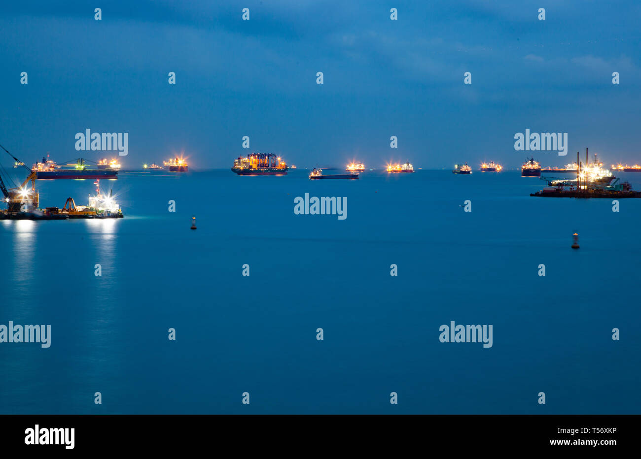 cargo ships at night Stock Photo - Alamy