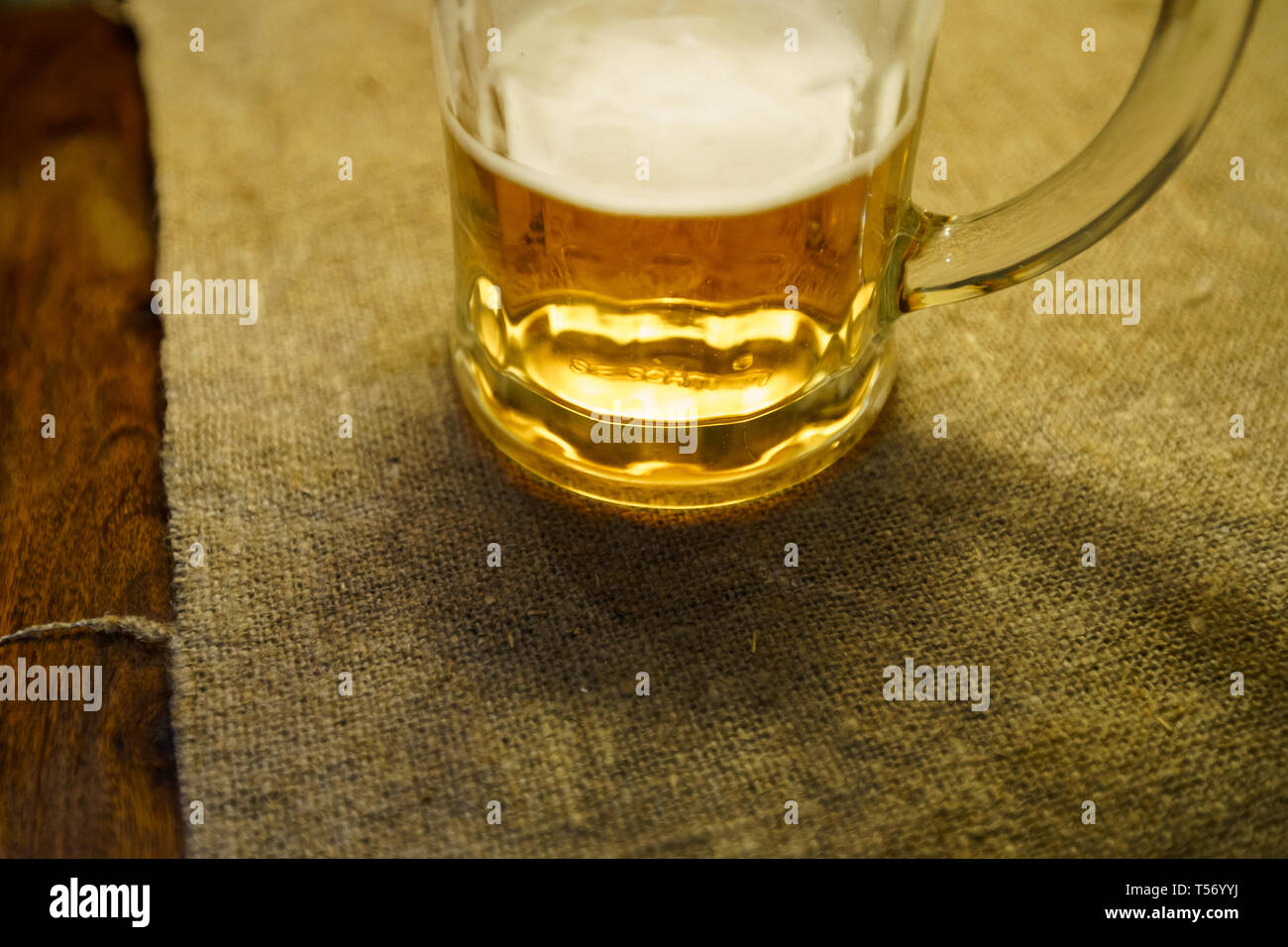 Beer glass at a restaurant table detail Stock Photo - Alamy
