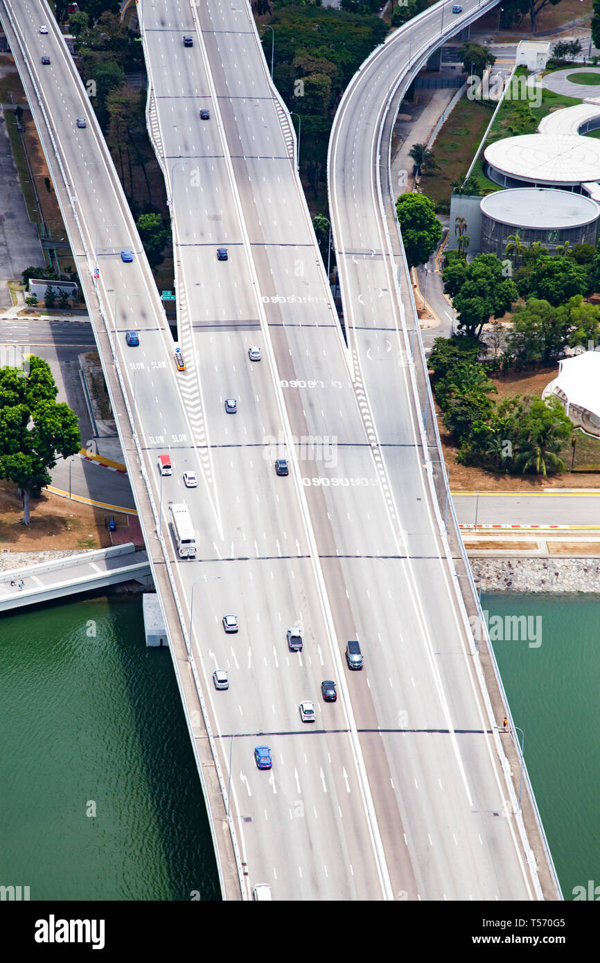 aerial view of a bridge and traffic and green water surface Stock Photo ...