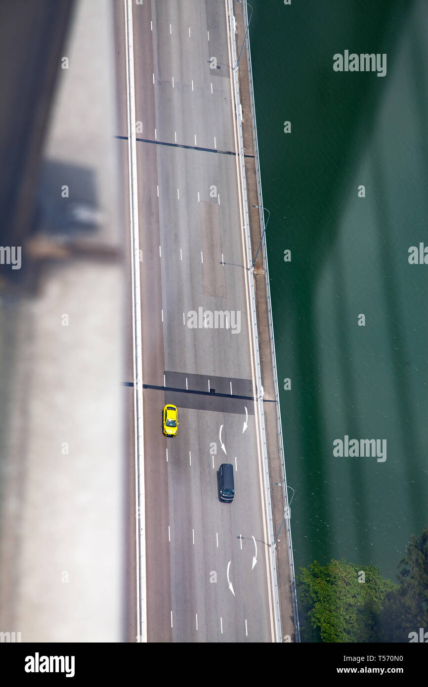 aerial view of a bridge and traffic and green water surface Stock Photo ...