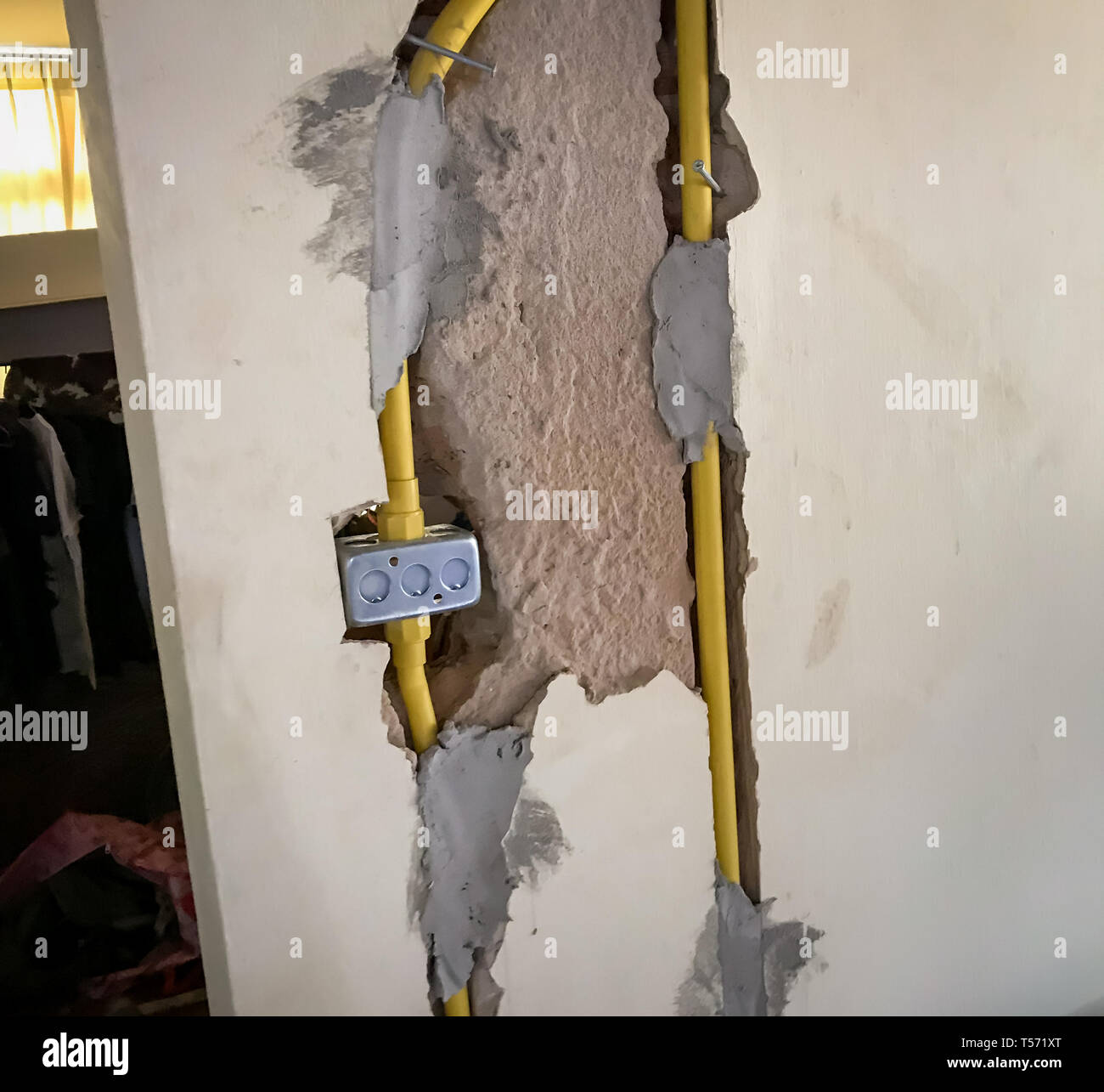 Electricity Pipe line renovation in to the wall Stock Photo - Alamy