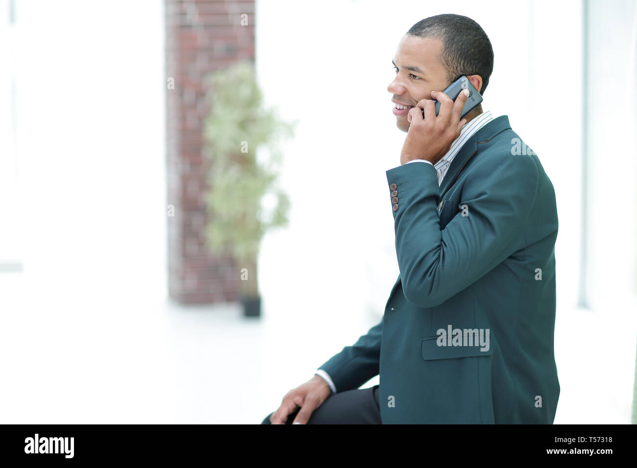 Manager talking on mobile phone in office.photo with copy space Stock ...
