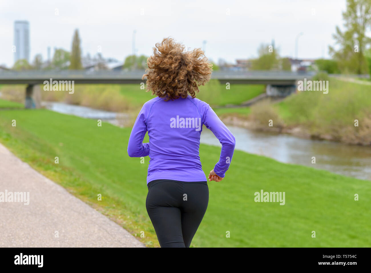 Woman running away from behind hi-res stock photography and images - Alamy