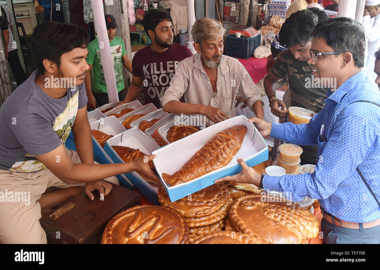 Dhaka, Bangladesh. 21st Apr, 2019. A man buys special breads made on ...