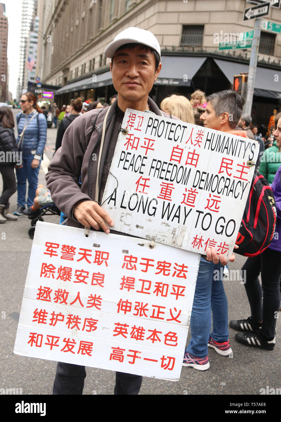 New York City, New York, USA. 21st Apr, 2019. An activist holds signs ...
