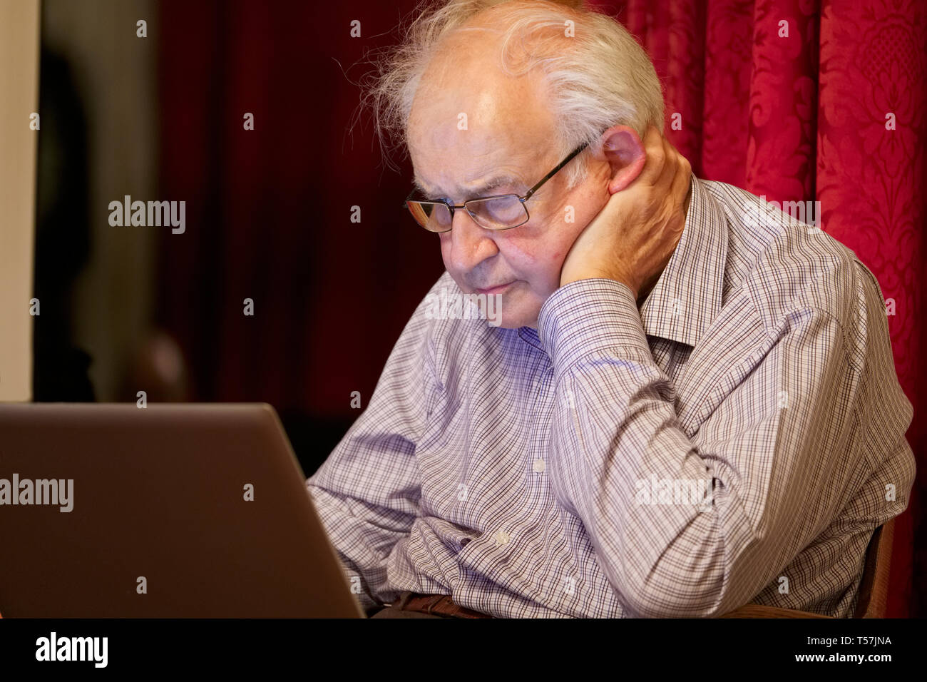 Old elderly senior person learning computer and online internet skills ...