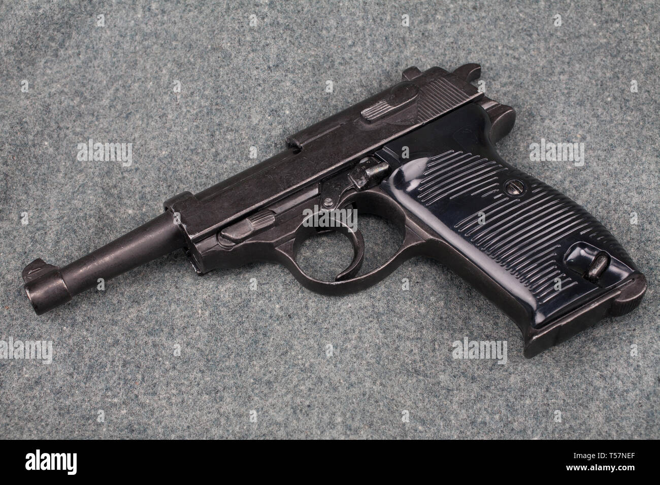 WWII era nazi german army 9 mm semi-automatic pistol on camouflaged ...