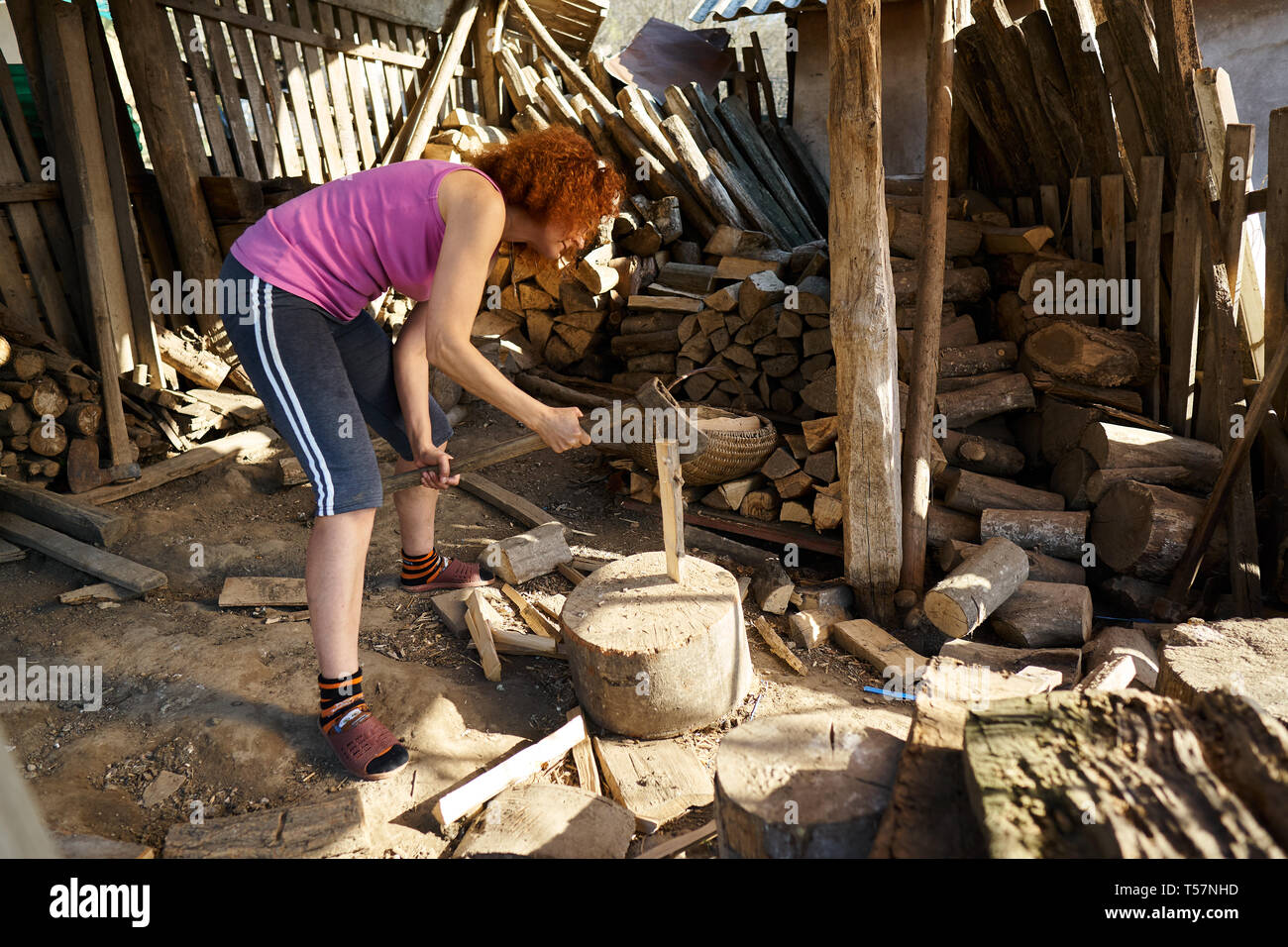 Woman firewood chop hi-res stock photography and images - Alamy