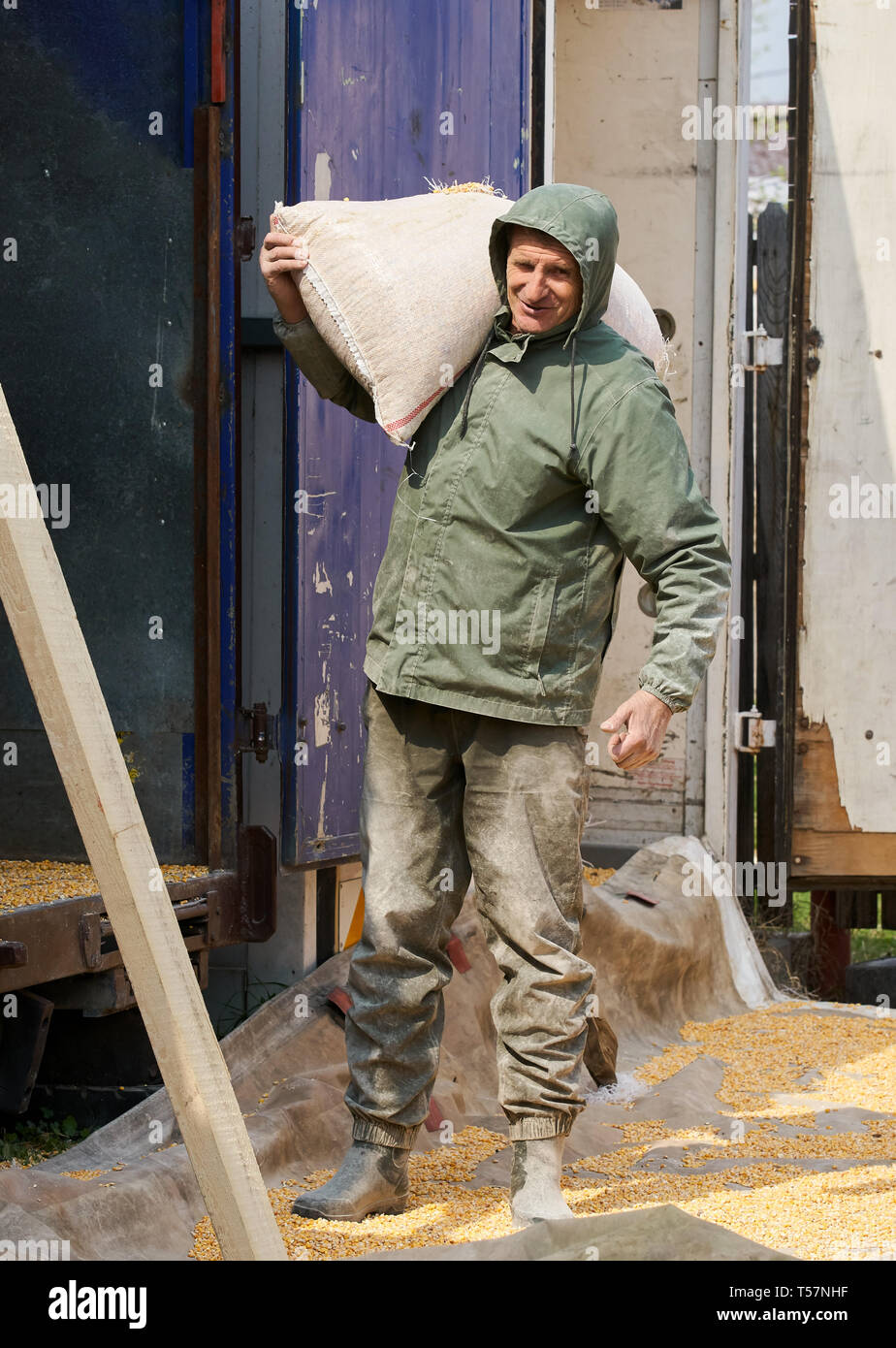 Farmer carrying a sack hi-res stock photography and images - Alamy