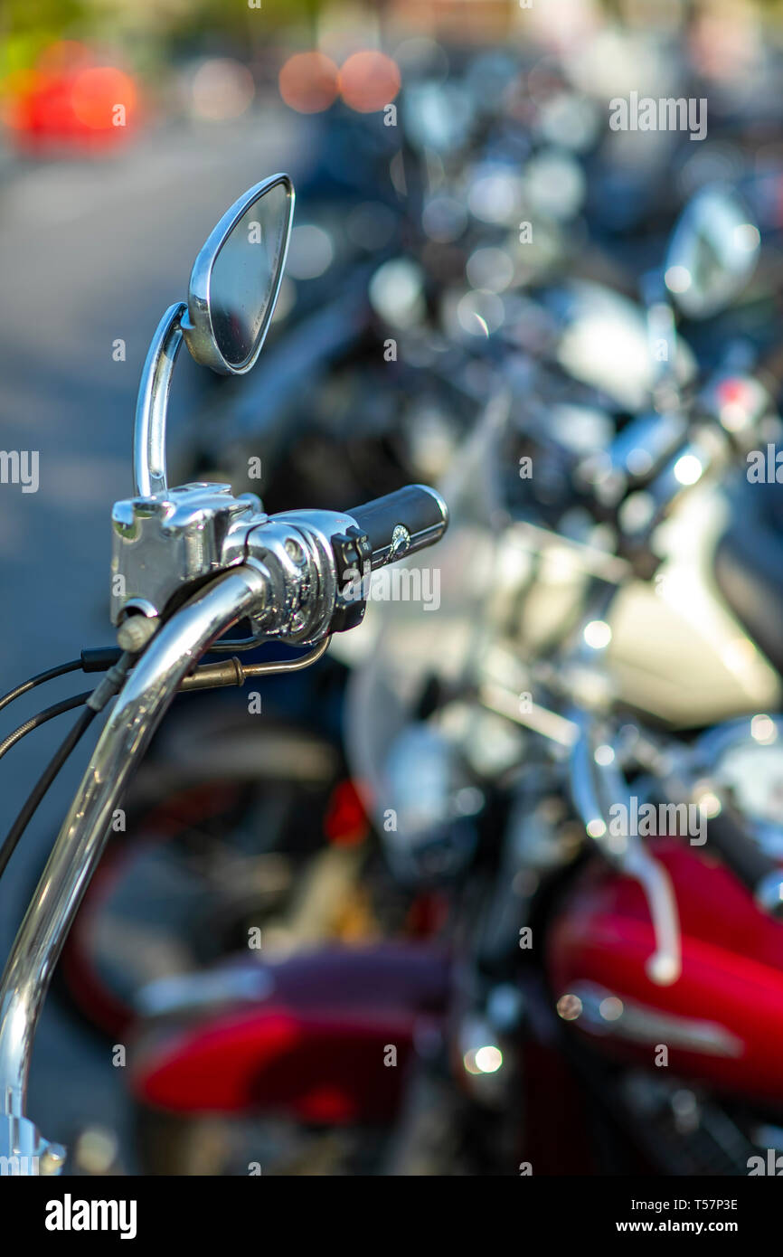 The chromed handlebar of a motorcycle. View of motorcycle handlebar in ...