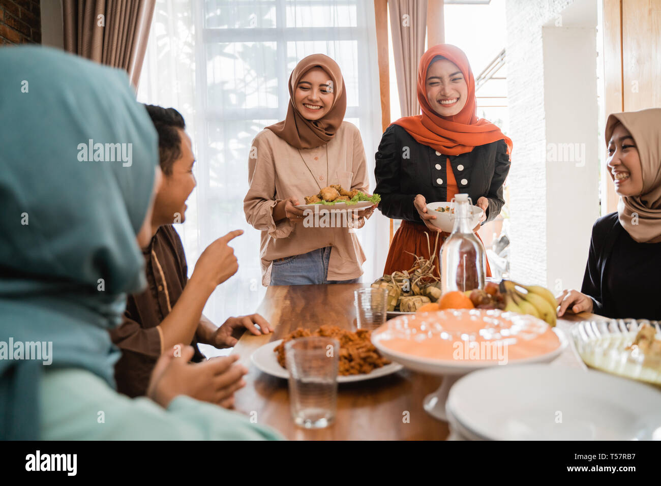 muslim people having some food together Stock Photo - Alamy