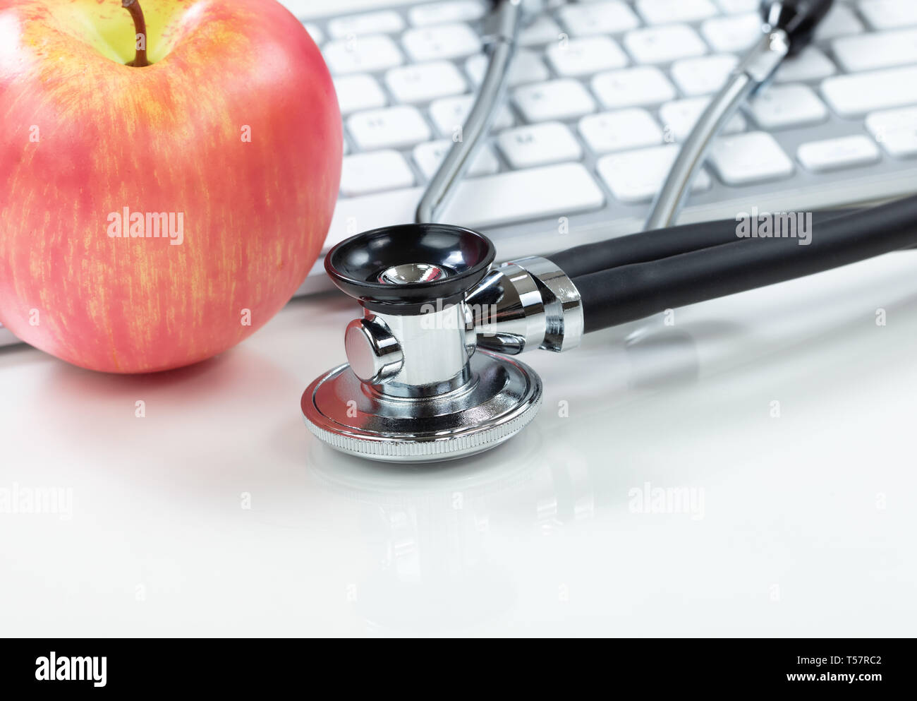 Medical health care concept with traditional stethoscope and apple with ...