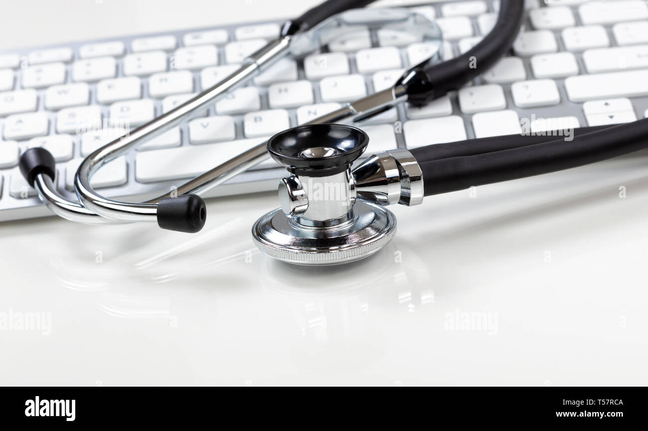 Medical health care concept with traditional stethoscope and computer ...