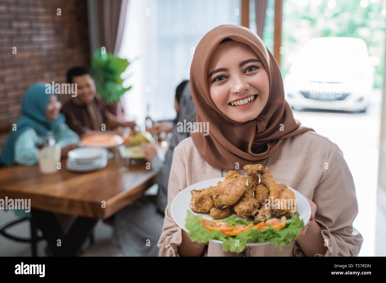 muslim woman with food served for family Stock Photo - Alamy
