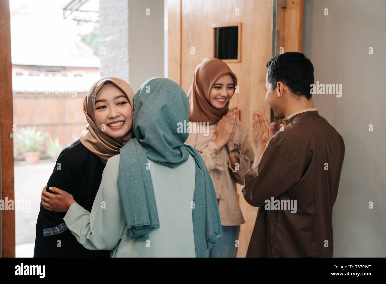 muslim family hug in eid mubarak celebration Stock Photo - Alamy