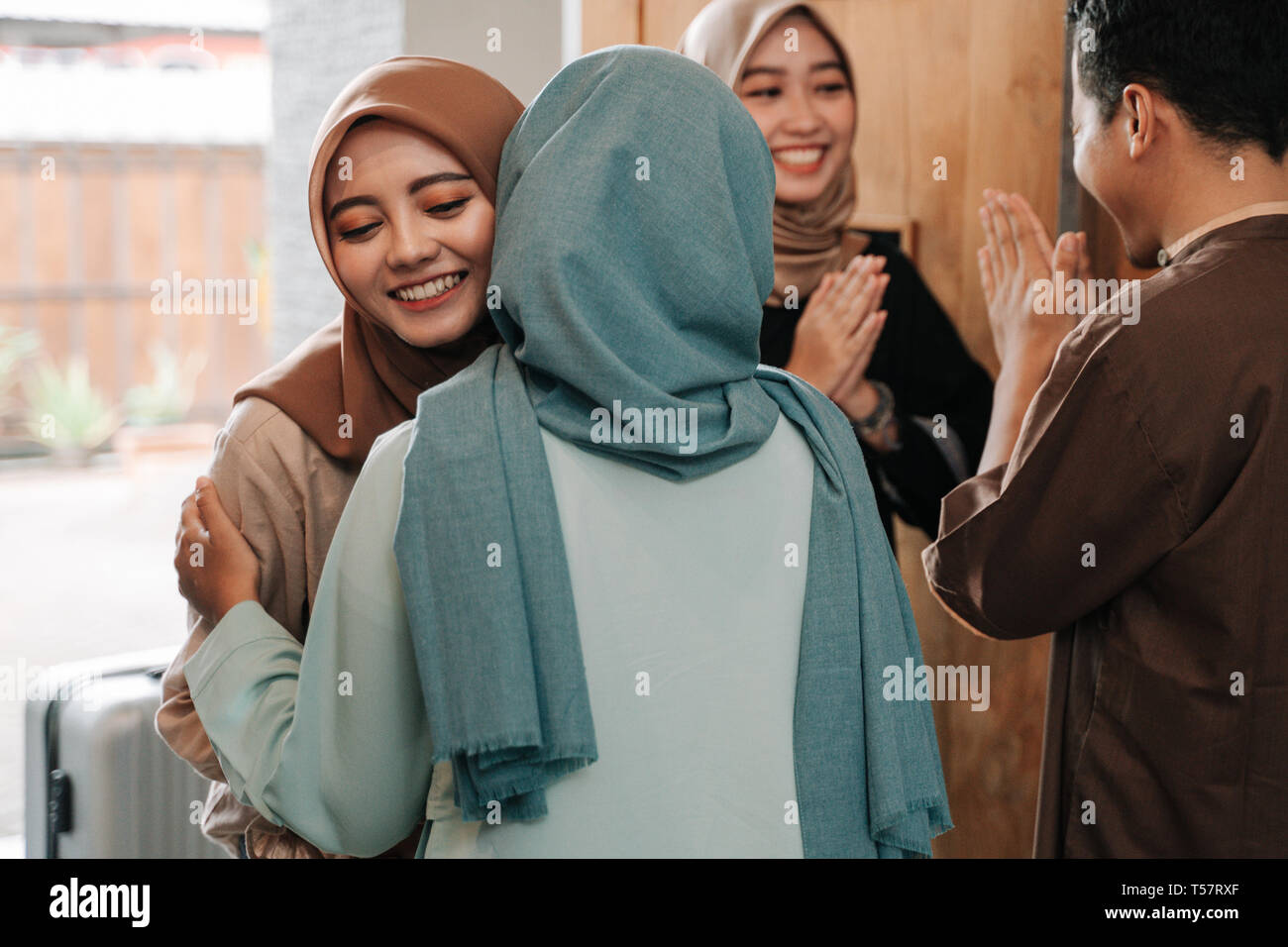 muslim family hug in eid mubarak celebration Stock Photo - Alamy