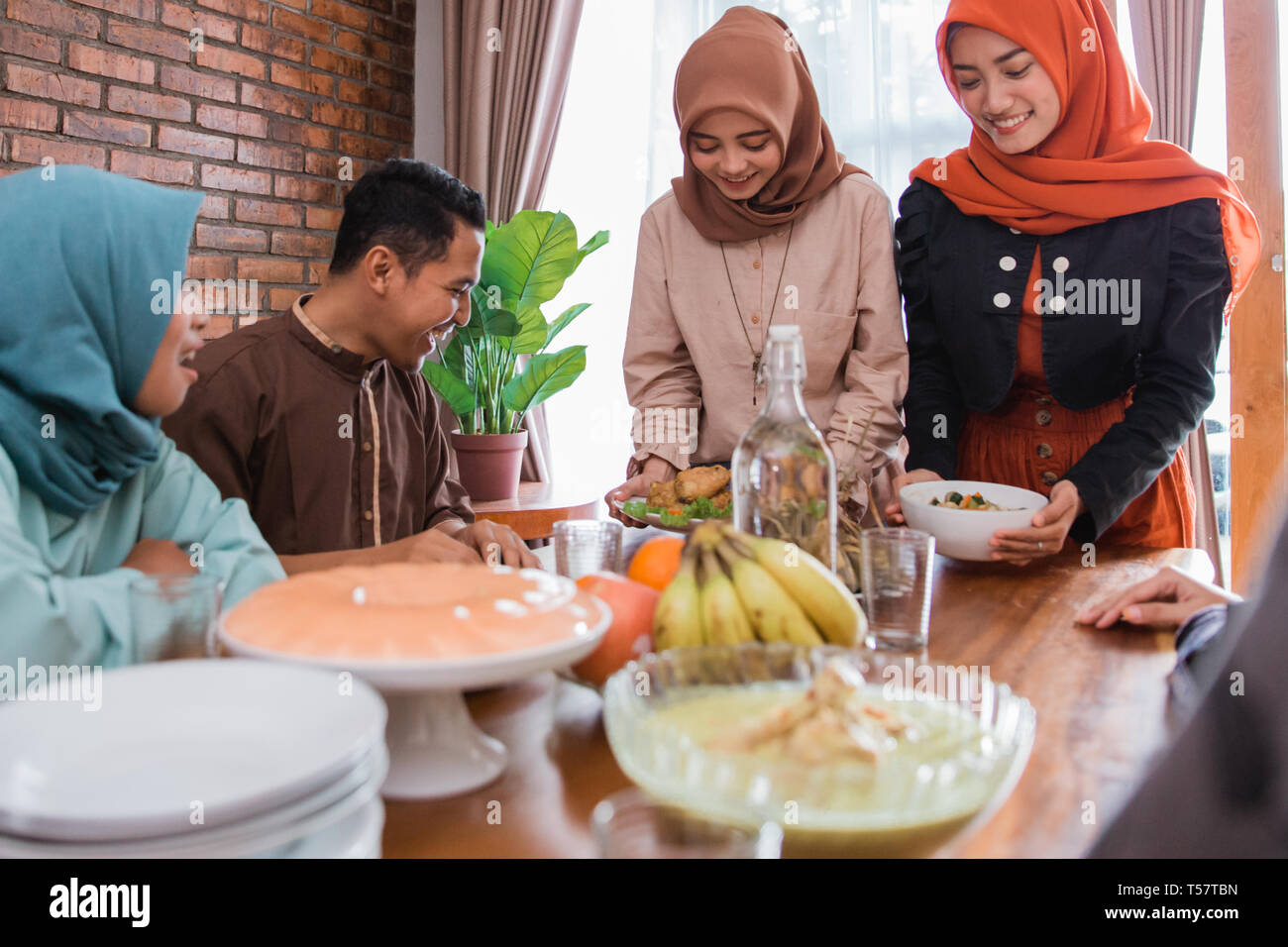 muslim people having some food together Stock Photo - Alamy